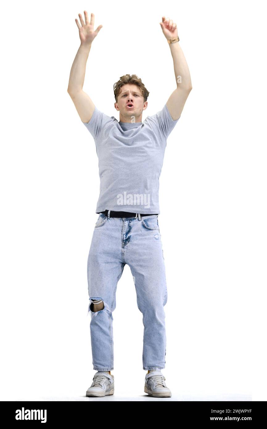 A man, on a white background, in full height, raised his hands Stock ...