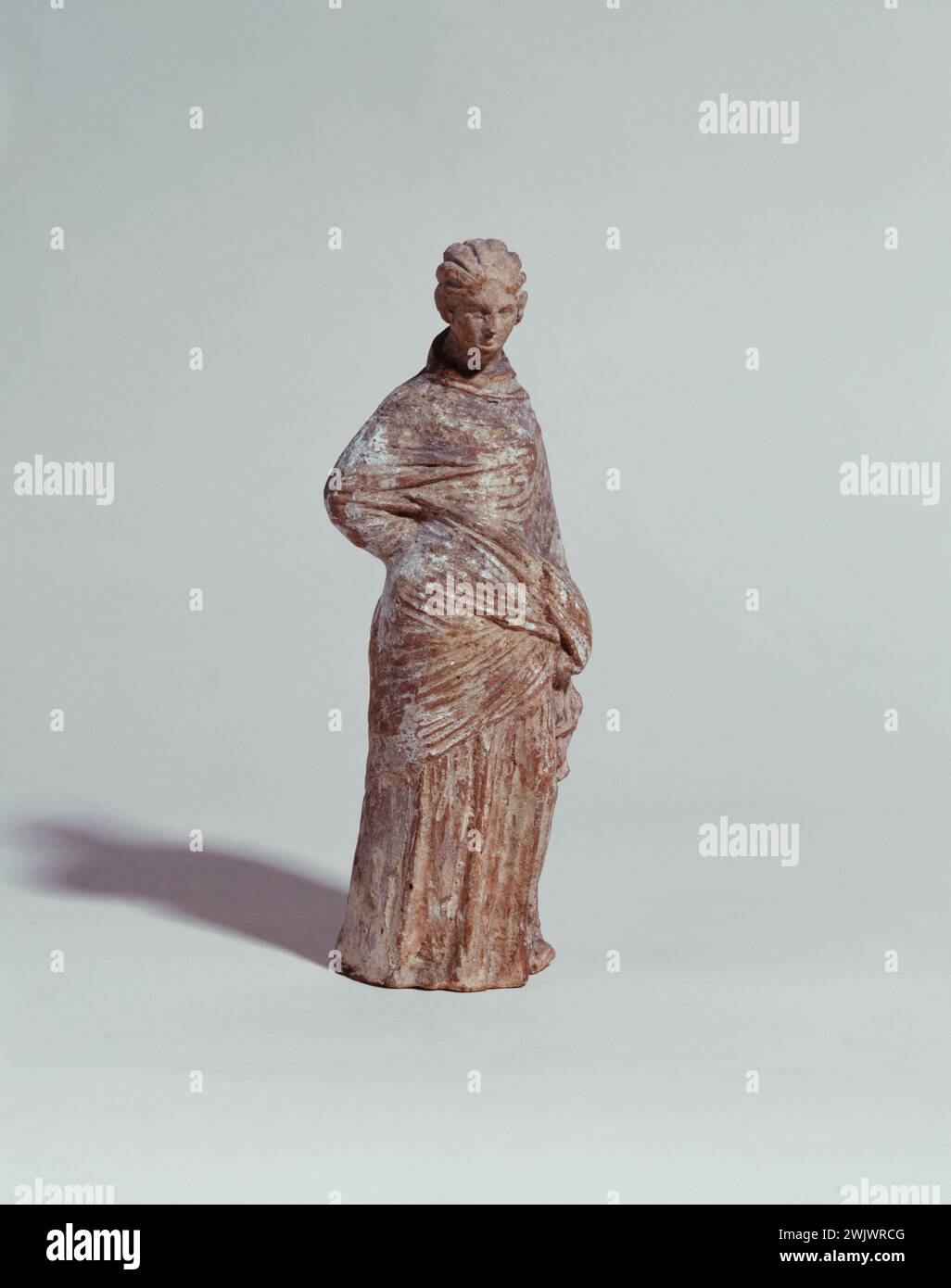 Anonymous. "Young woman standing". Molded terracotta, red earth, white ...