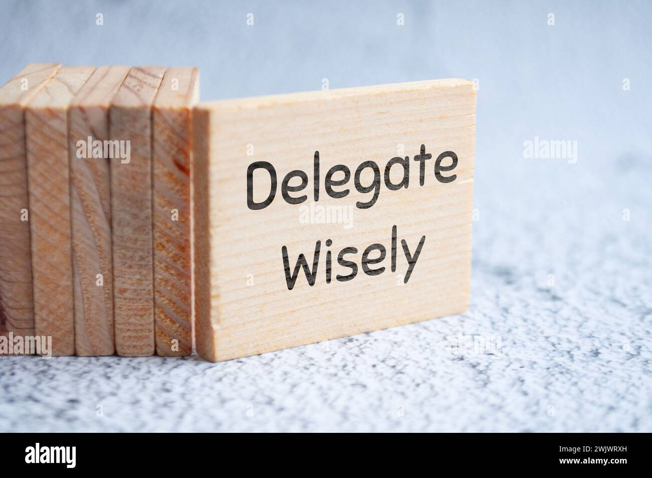 Delegate wisely text on wooden blocks. Delegation of duty concept Stock ...