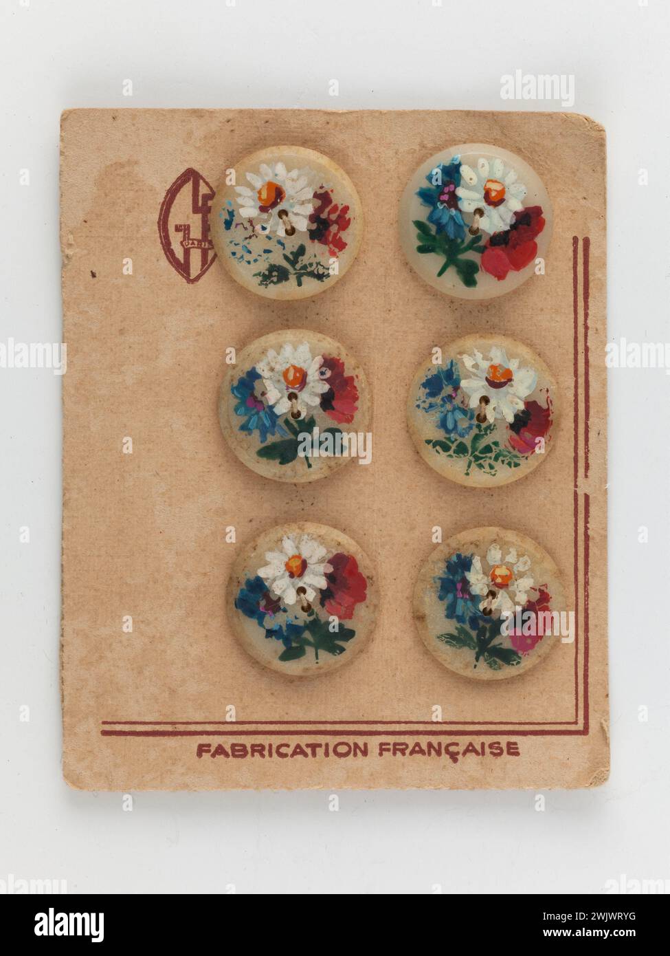 Galeries Lafayette. Plate of six tricolor flower buttons from Galeries ...