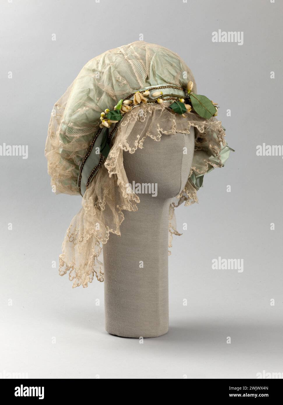 Bonnet by Saint Catherine. Ivory tulle, blue silk satin, waxing flowers ...