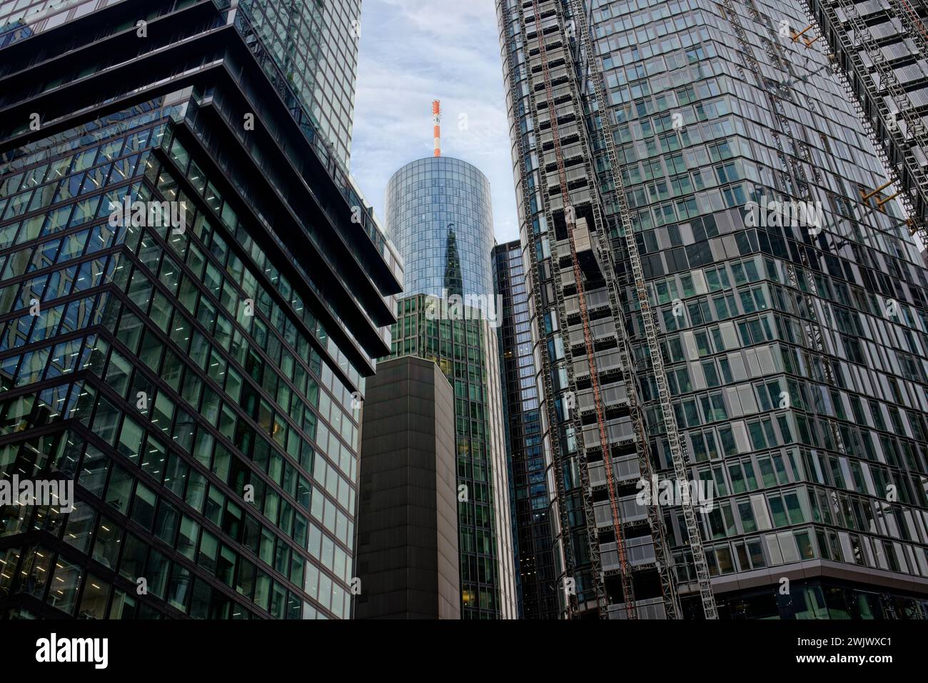 Construction site at the top of a skyscraper with reflection in the ...
