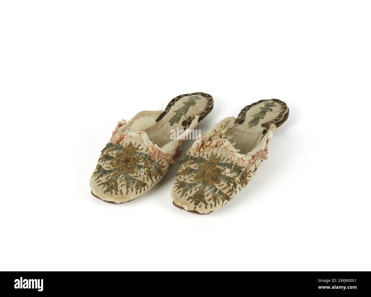 Embroidery on beige fabric Cut Out Stock Images & Pictures - Alamy