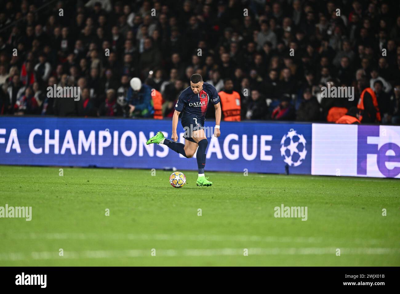 PARIS, FRANCE - FEBRUARY 14: Kylian Mbappe full length body in home kit ...