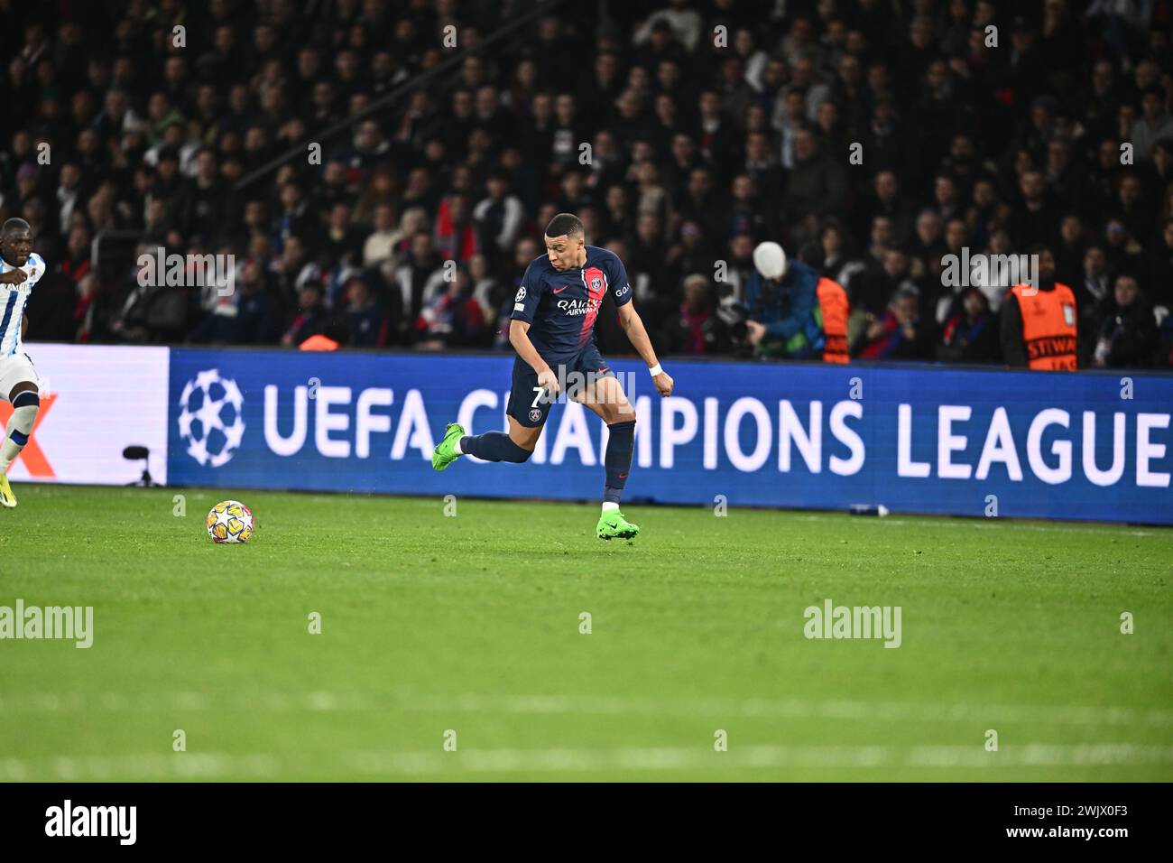 PARIS, FRANCE - FEBRUARY 14: Kylian Mbappe full length body in home kit ...