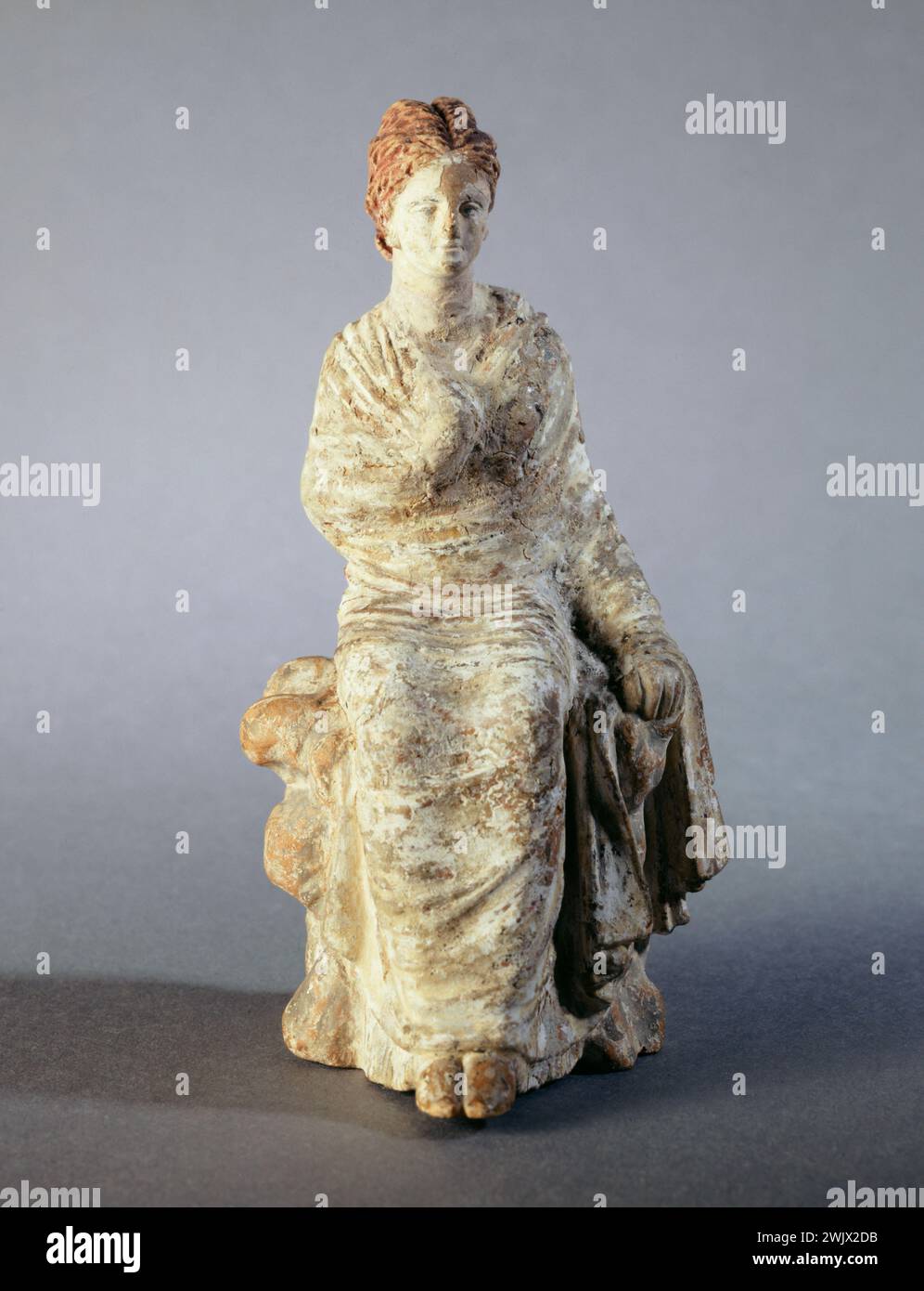 Anonymous. "Young woman sitting on a rock". Molded terracotta, pinkish ...