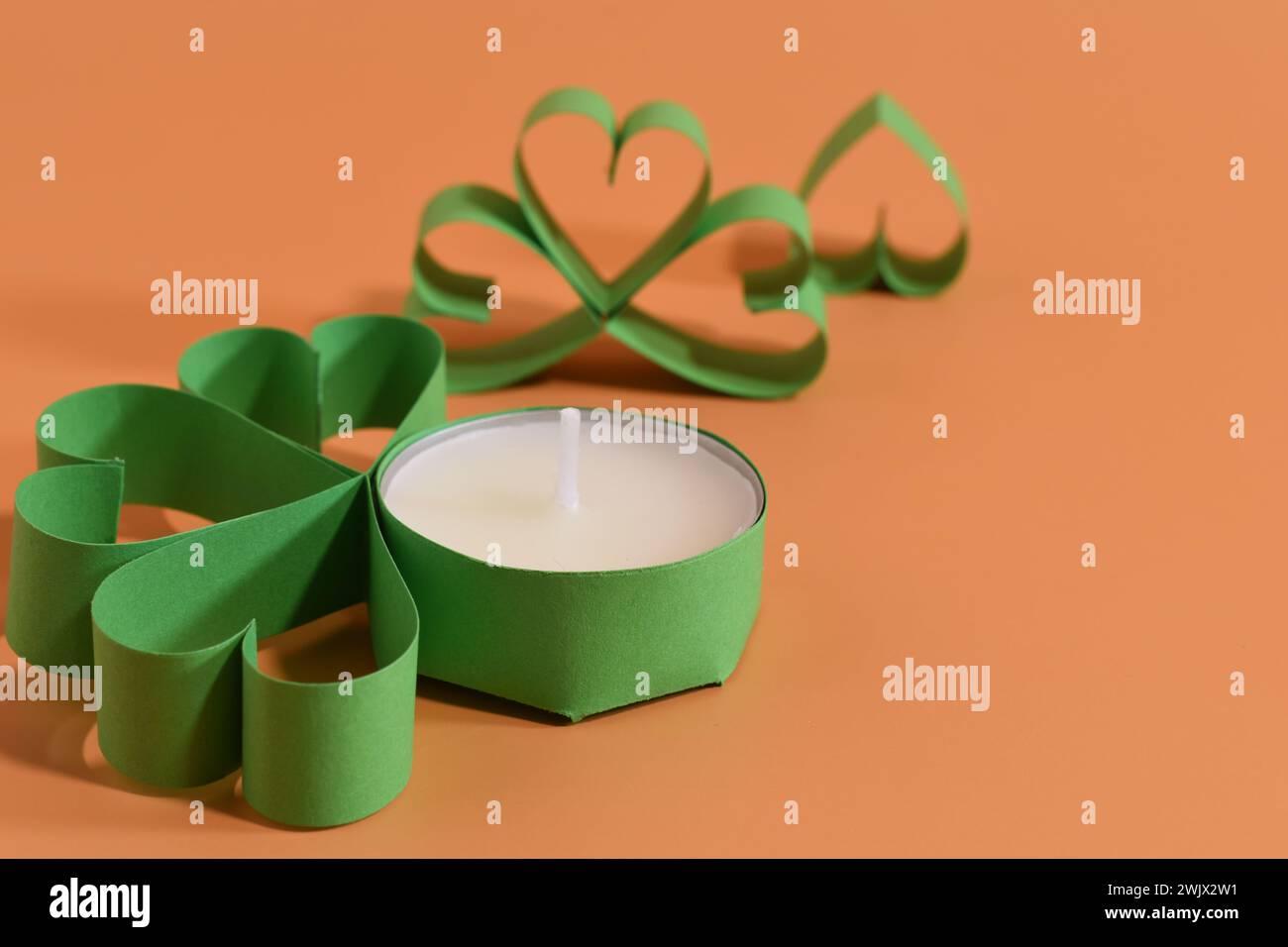 Saint Patrick Day concept. Paper craft candles holders and clover on ...