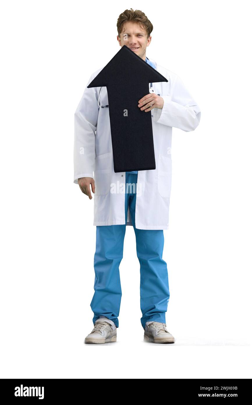 The doctor, in full height, on a white background, points up with an ...