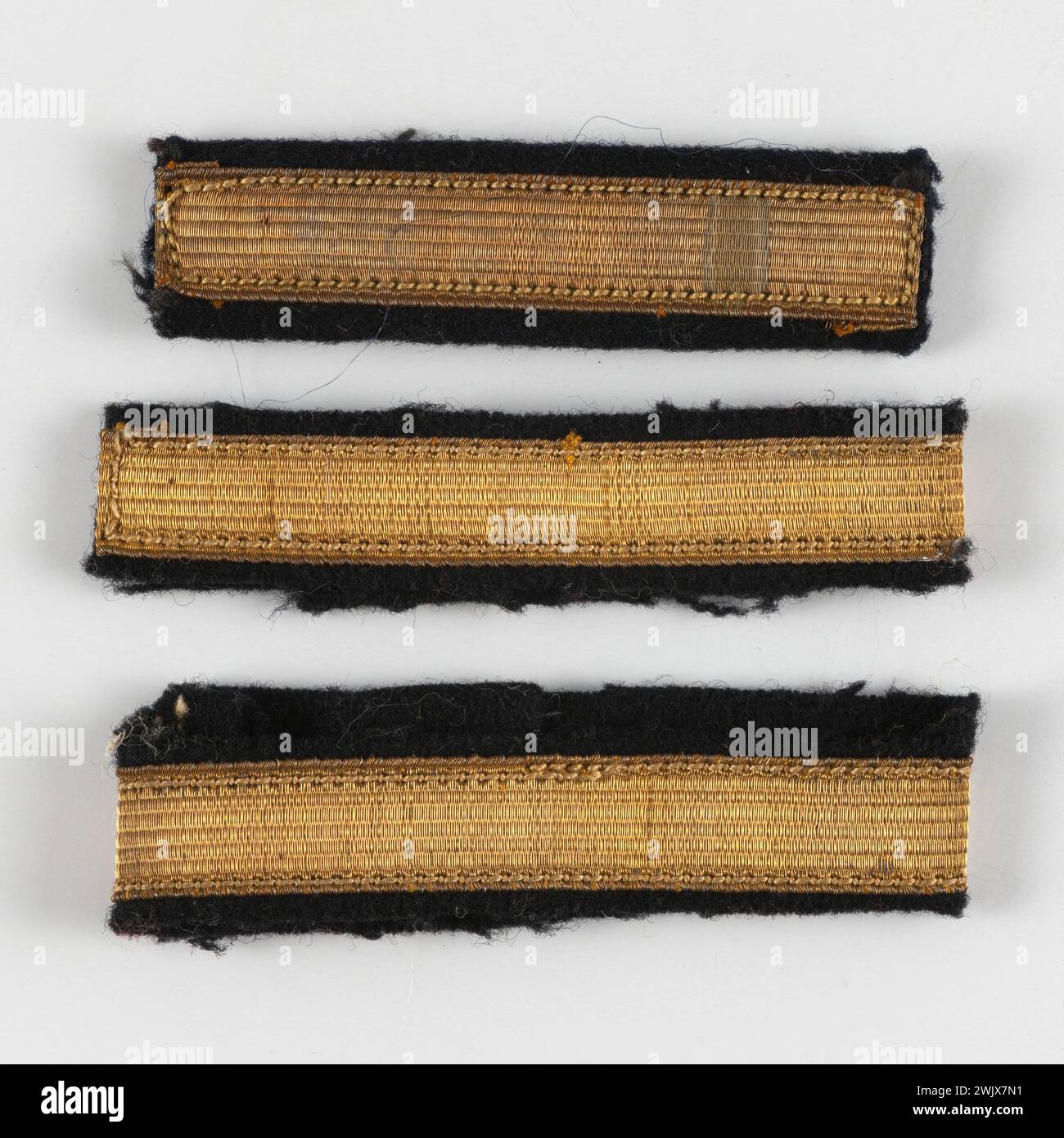 Braid. Three braids of sub-lieutenant shoulder. Black and gold fabric ...