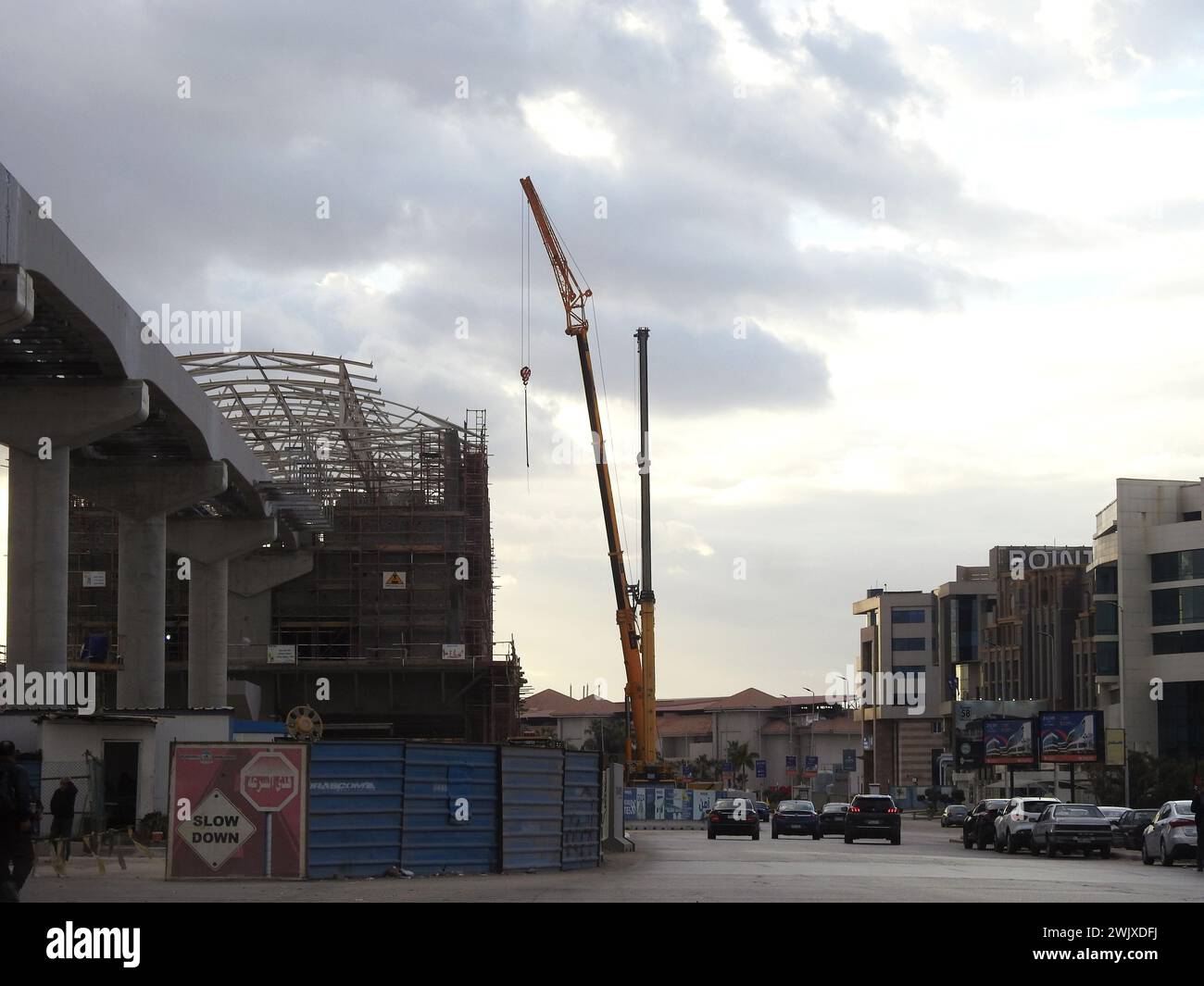 Cairo, Egypt, January 26 2024: A monorail station site that is under construction with scaffolds ...