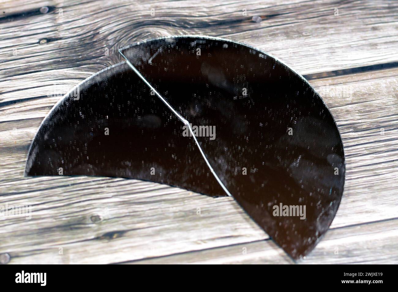 Broken hand mirror, cracked, crushed damaged mirror glass, a mirror is ...