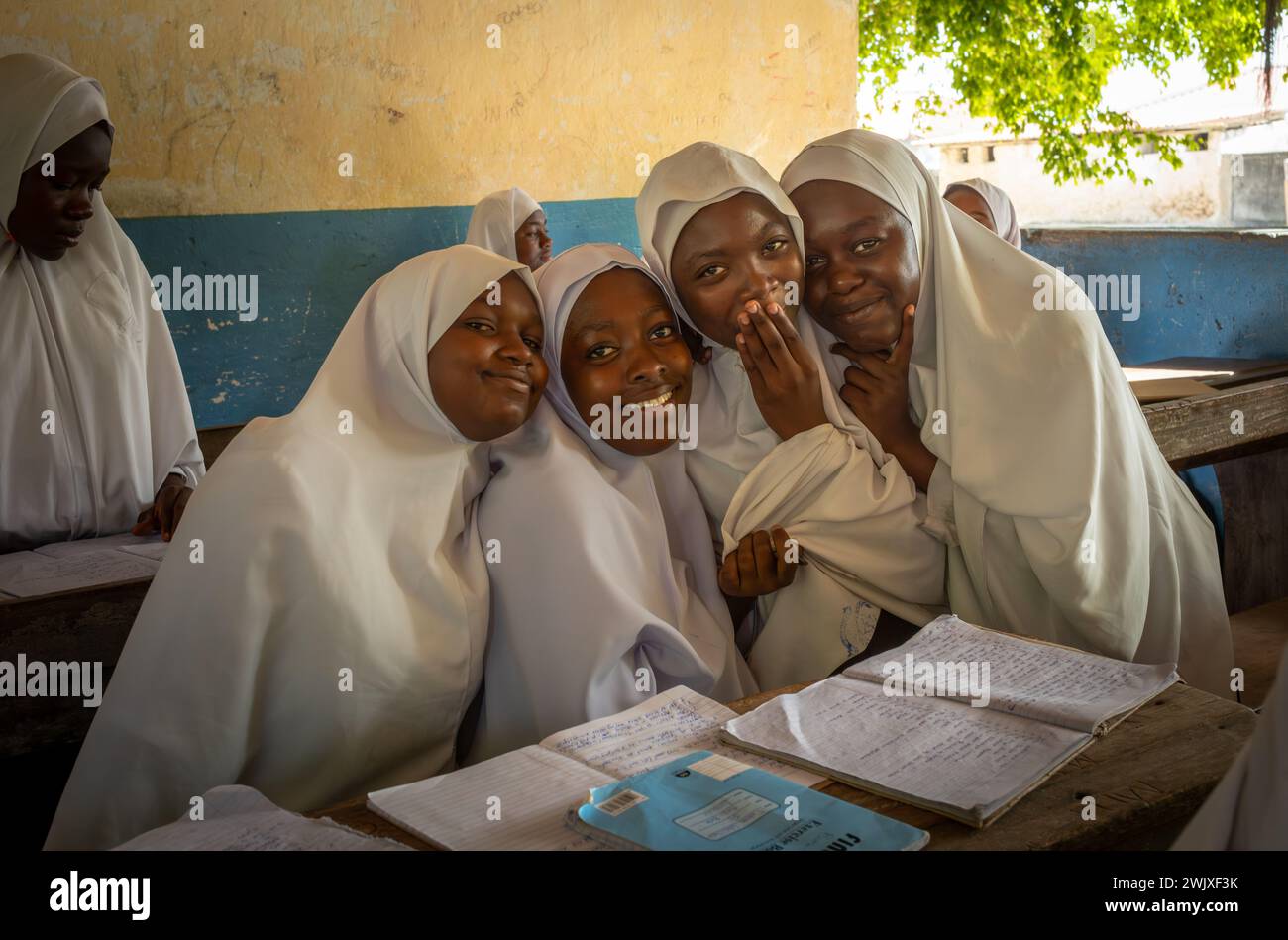 Four muslim girls in their classroom at Jambiani Secondary School in ...