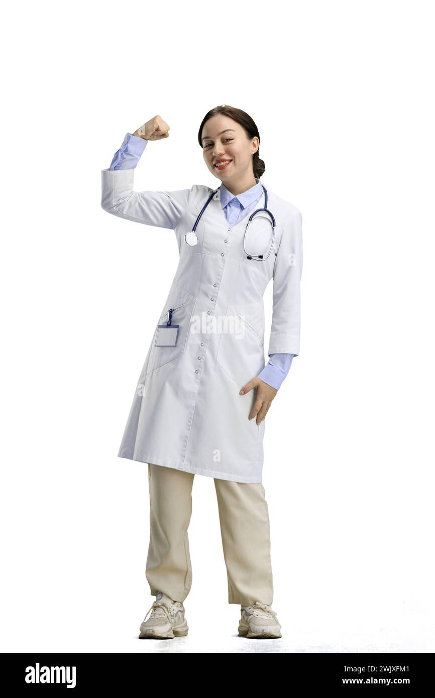 Female doctor, full-length, on a white background, shows strength Stock ...