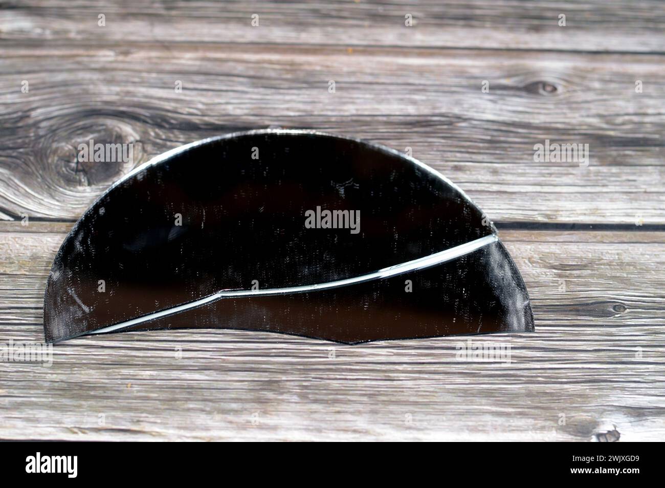 Broken hand mirror, cracked, crushed damaged mirror glass, a mirror is ...