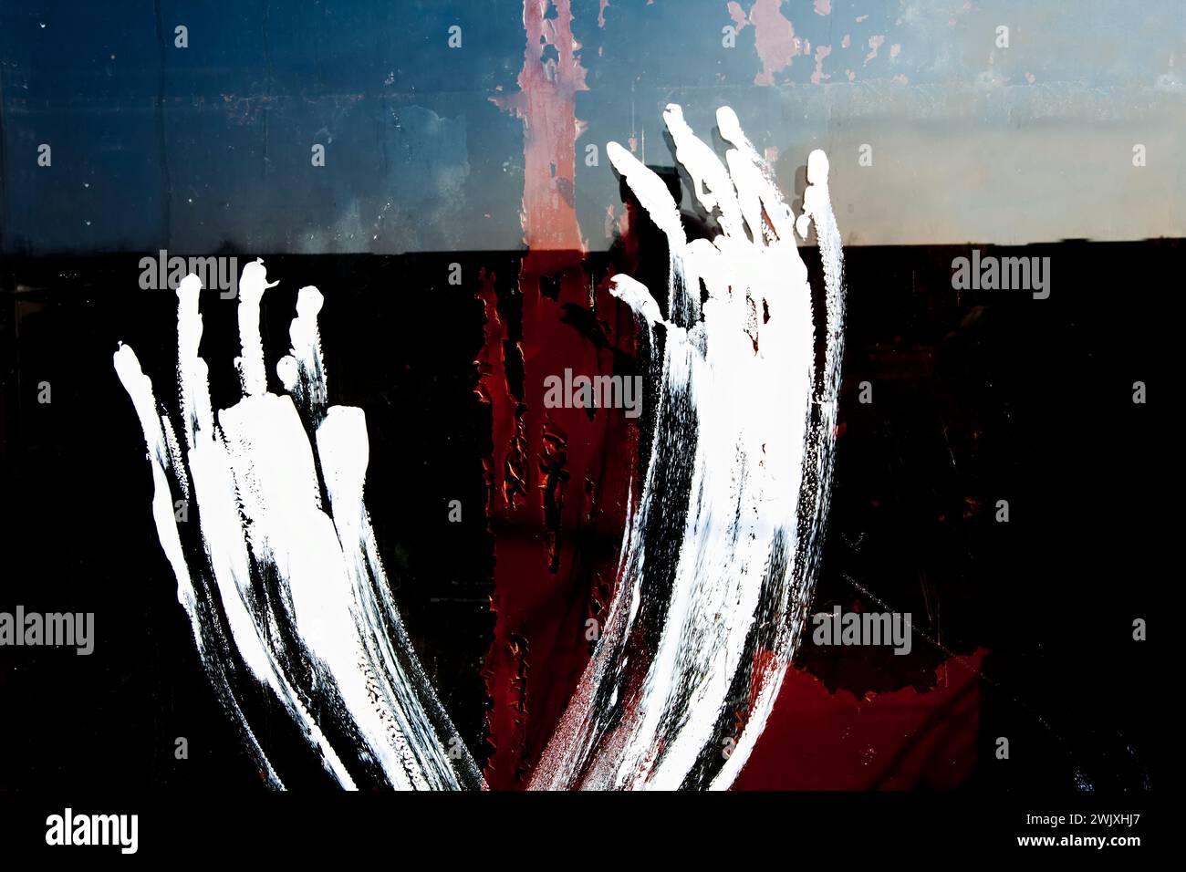 Smudgy handprints on an old glass panel Stock Photo - Alamy