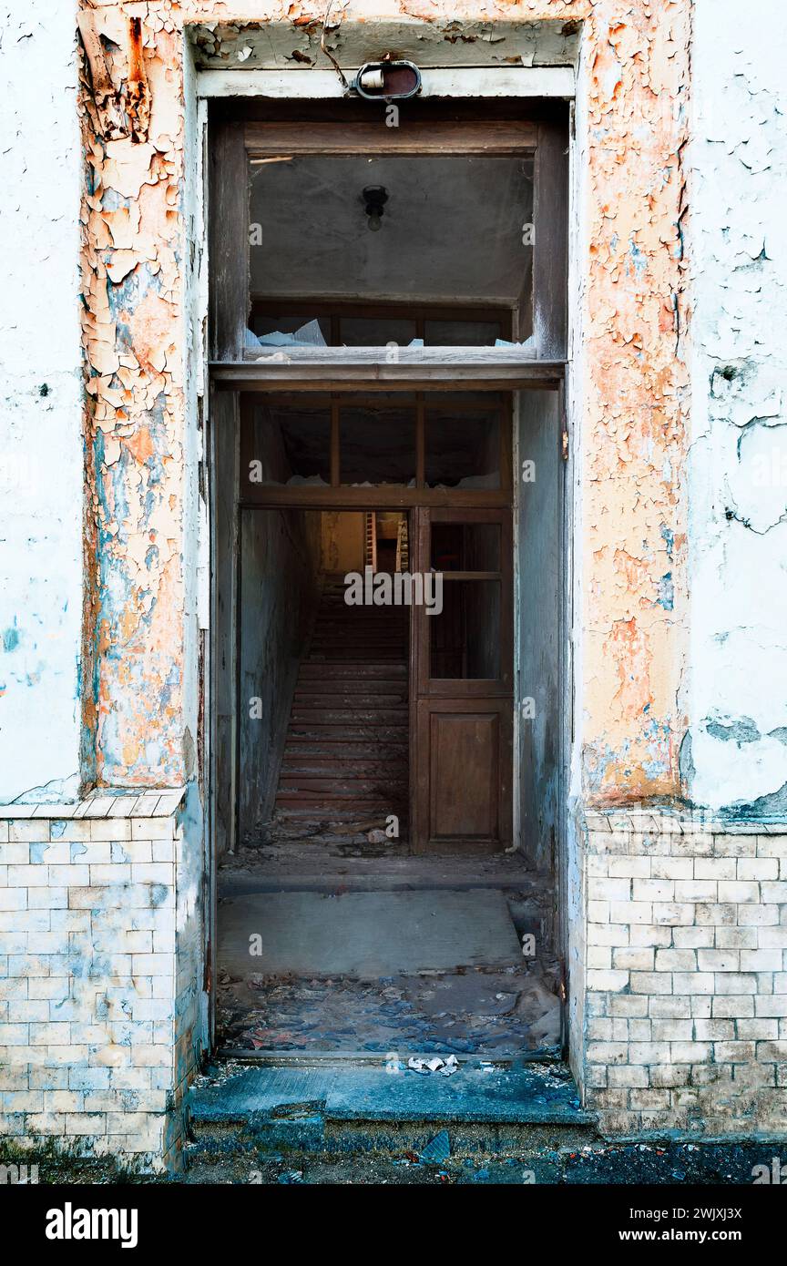 abandoned house in poor condition. cracked panes in the windows ...