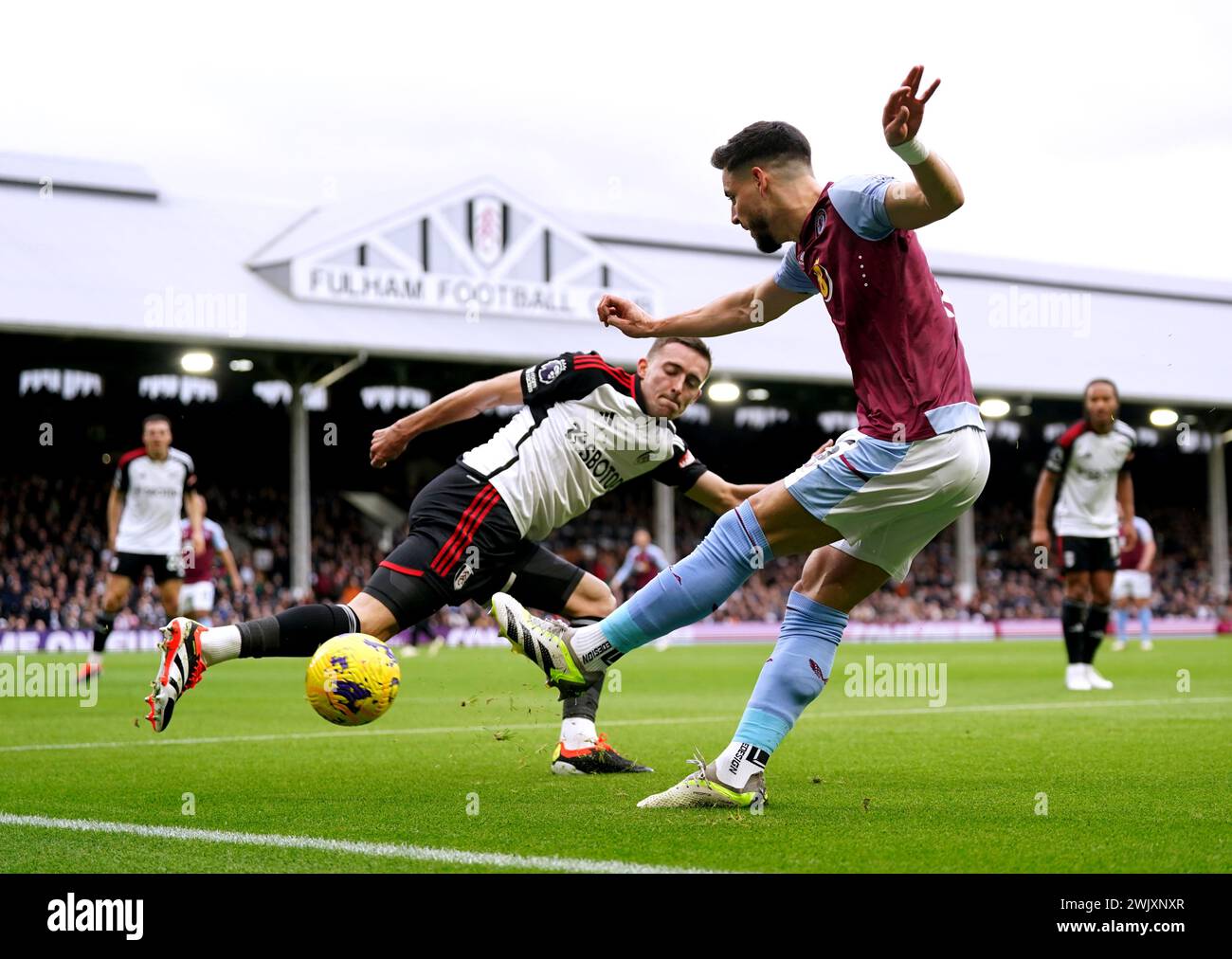 Aston Villa's Alex Moreno (right) and Fulham's Timothy Castagne battle ...
