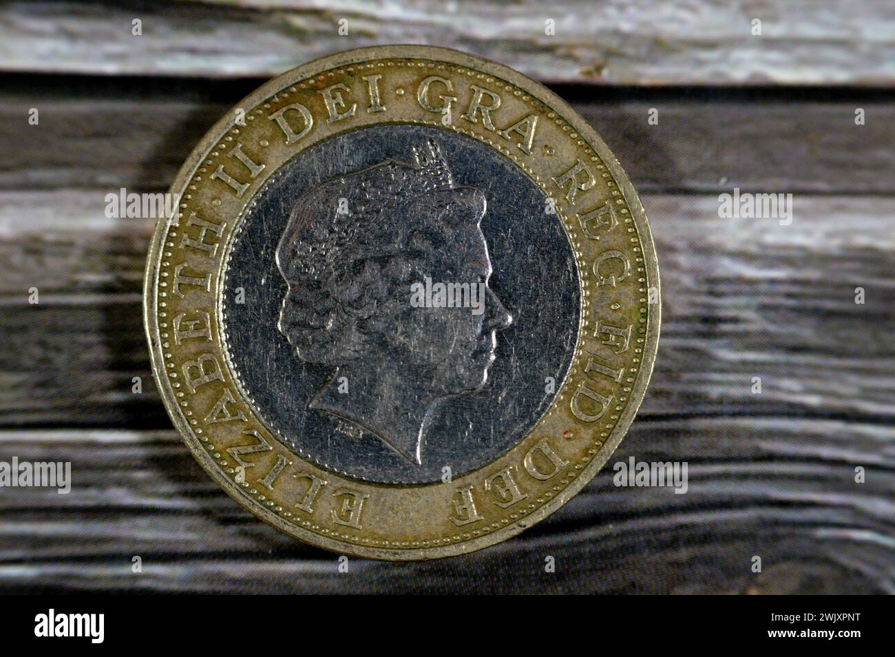 Two British sterling pounds 1998 coin features queen Elizabeth ii on the obverse and Four ...