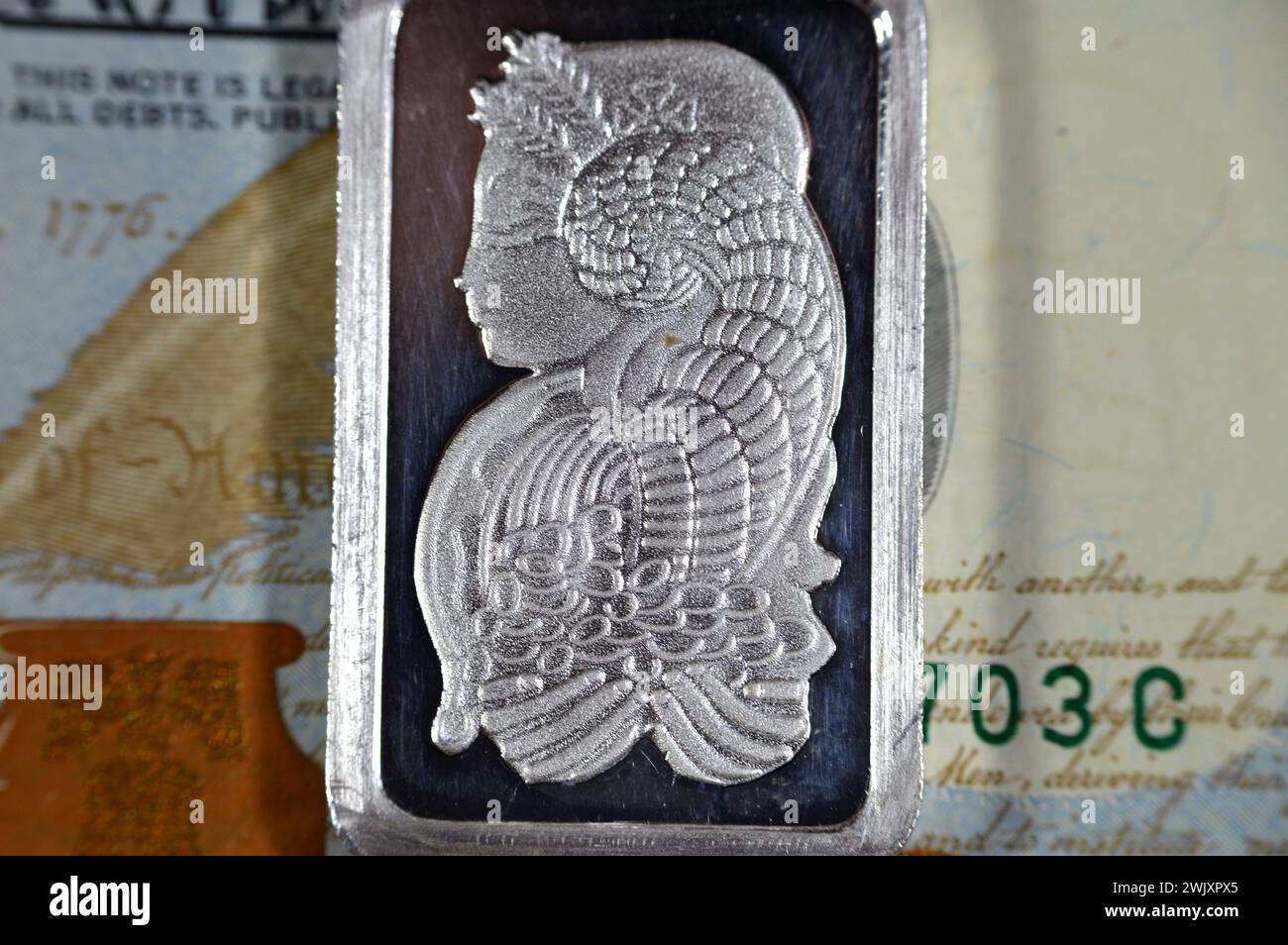 USD American 100 dollars cash money and silver precious metal ounce bar ...