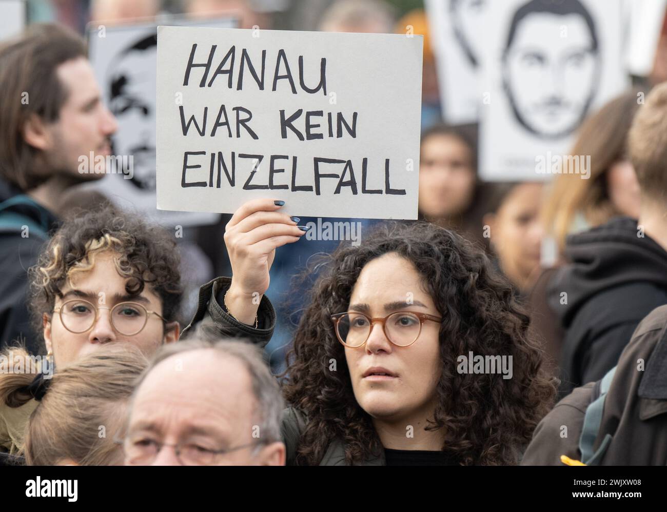 Hanau, Germany. 17th Feb, 2024. People march through the city center during a memorial march to ...