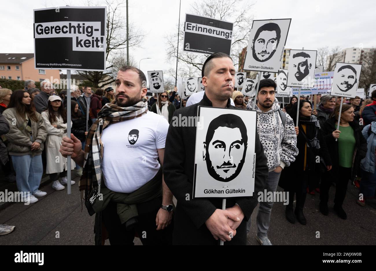 Hanau, Germany. 17th Feb, 2024. People march through the city center during a memorial march to ...