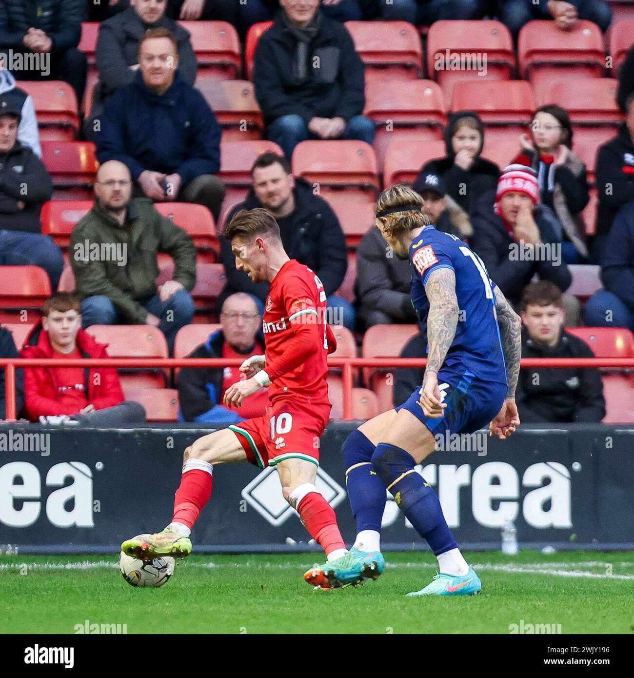 Walsall, UK. 17th Feb, 2024. Walsall's Tom Knowles pressed by Mansfield ...