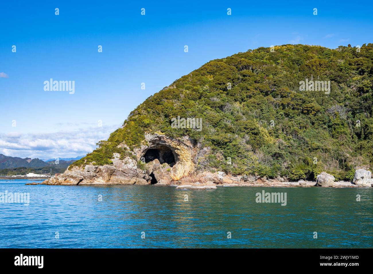 Rock in the shape of a fish head, with a shrine built inside the fish ...