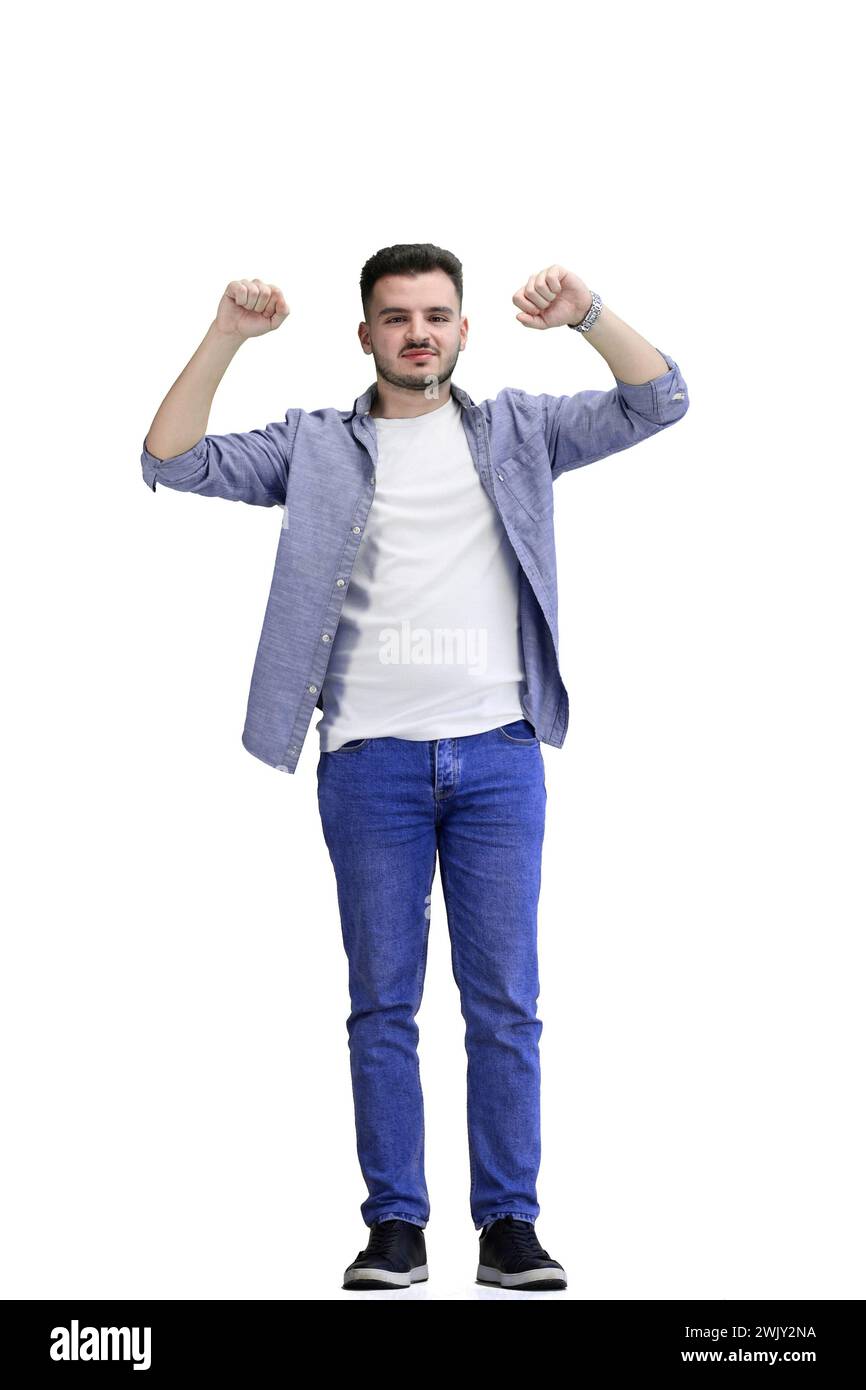 A man, full-length, on a white background, raised his hands up Stock ...