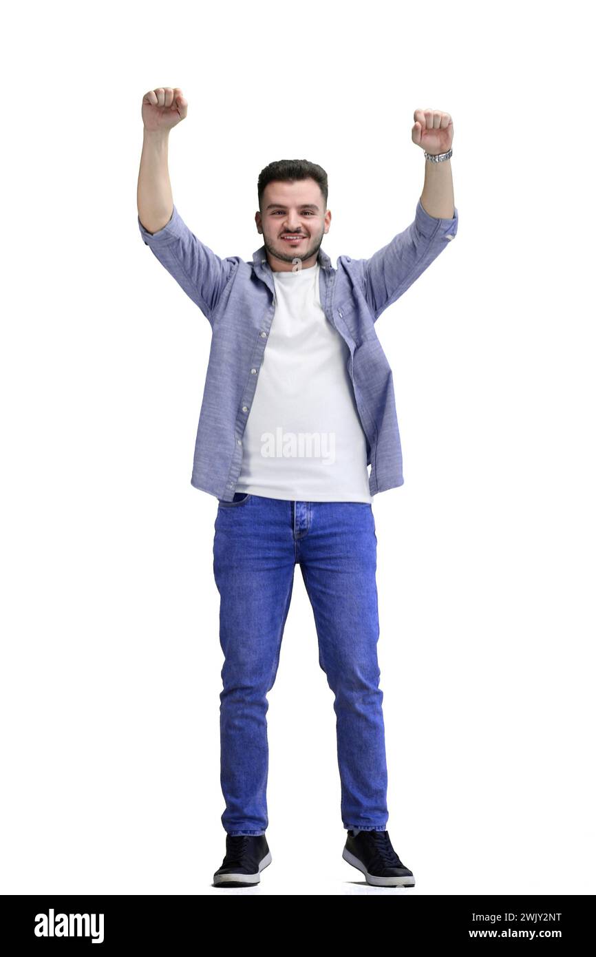 A man, full-length, on a white background, raised his hands up Stock ...