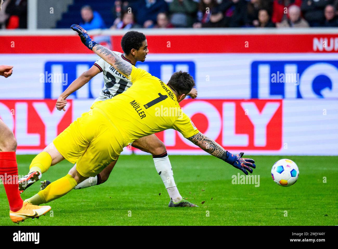 Leverkusen's Amine Adli, rear, scores his side's second goal during the ...