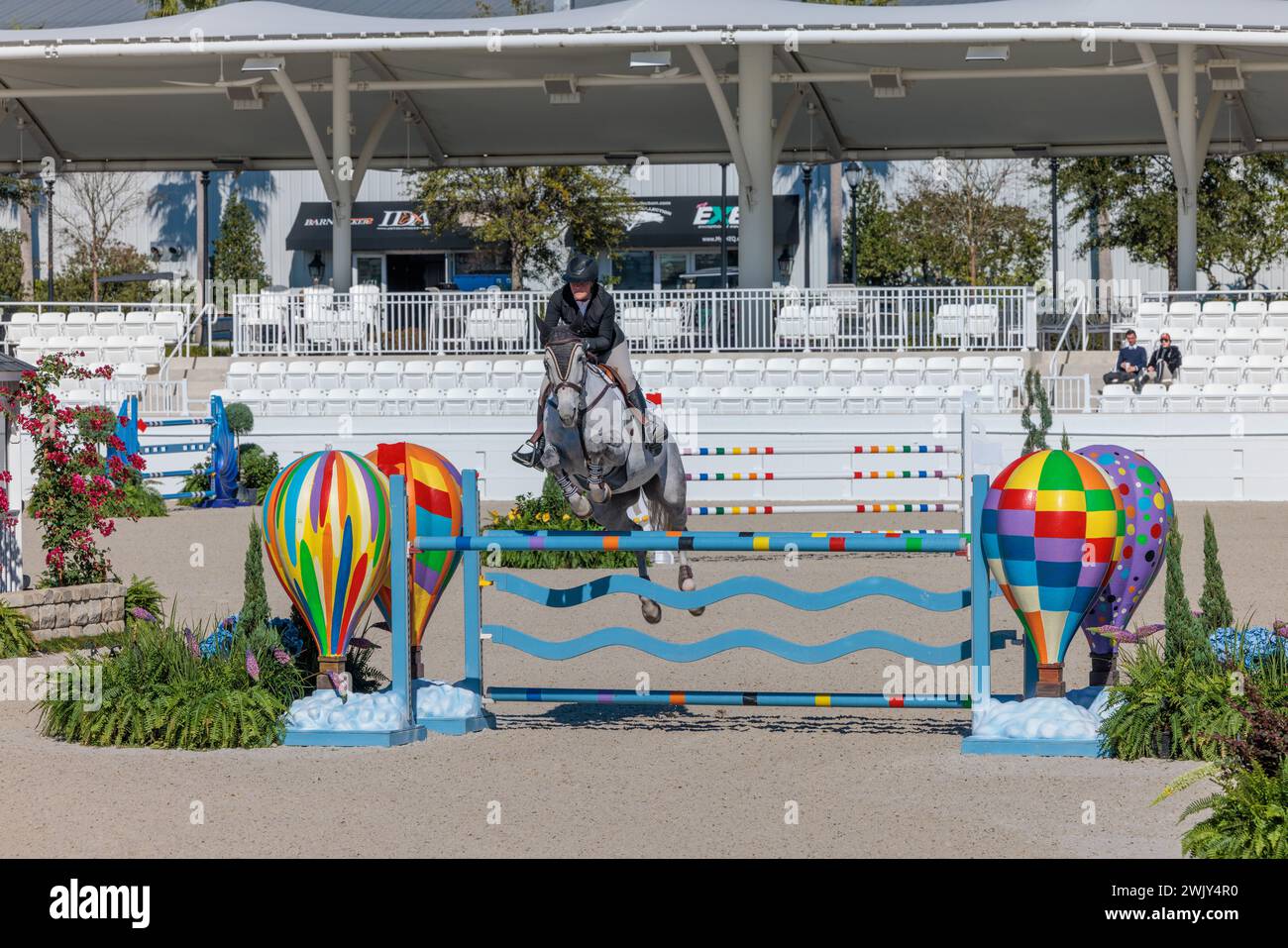 Rider competing in the Hunter Jumper competition in the Grand Outdoor ...
