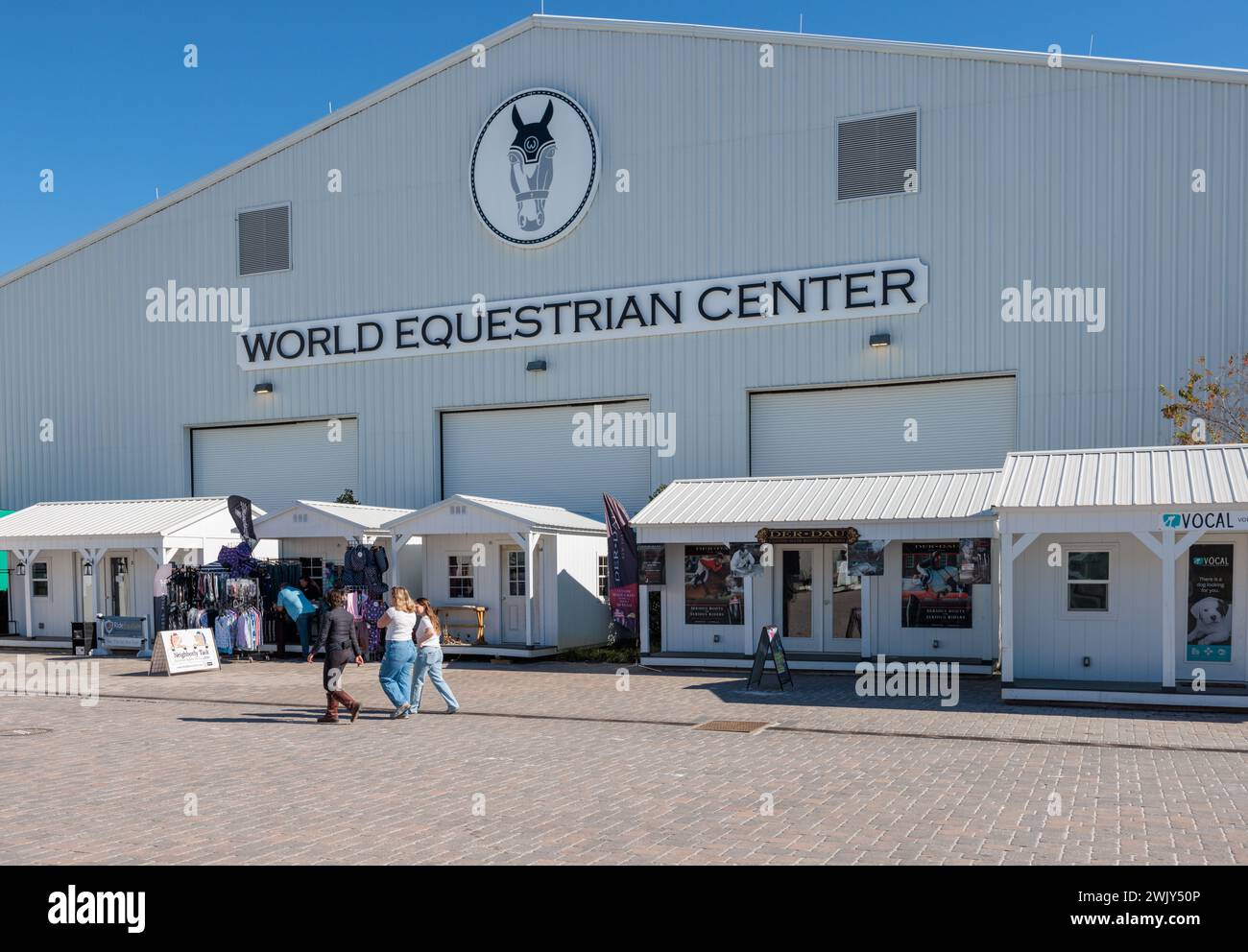 Small shops in portabal buildings in front of indoor arena building at ...