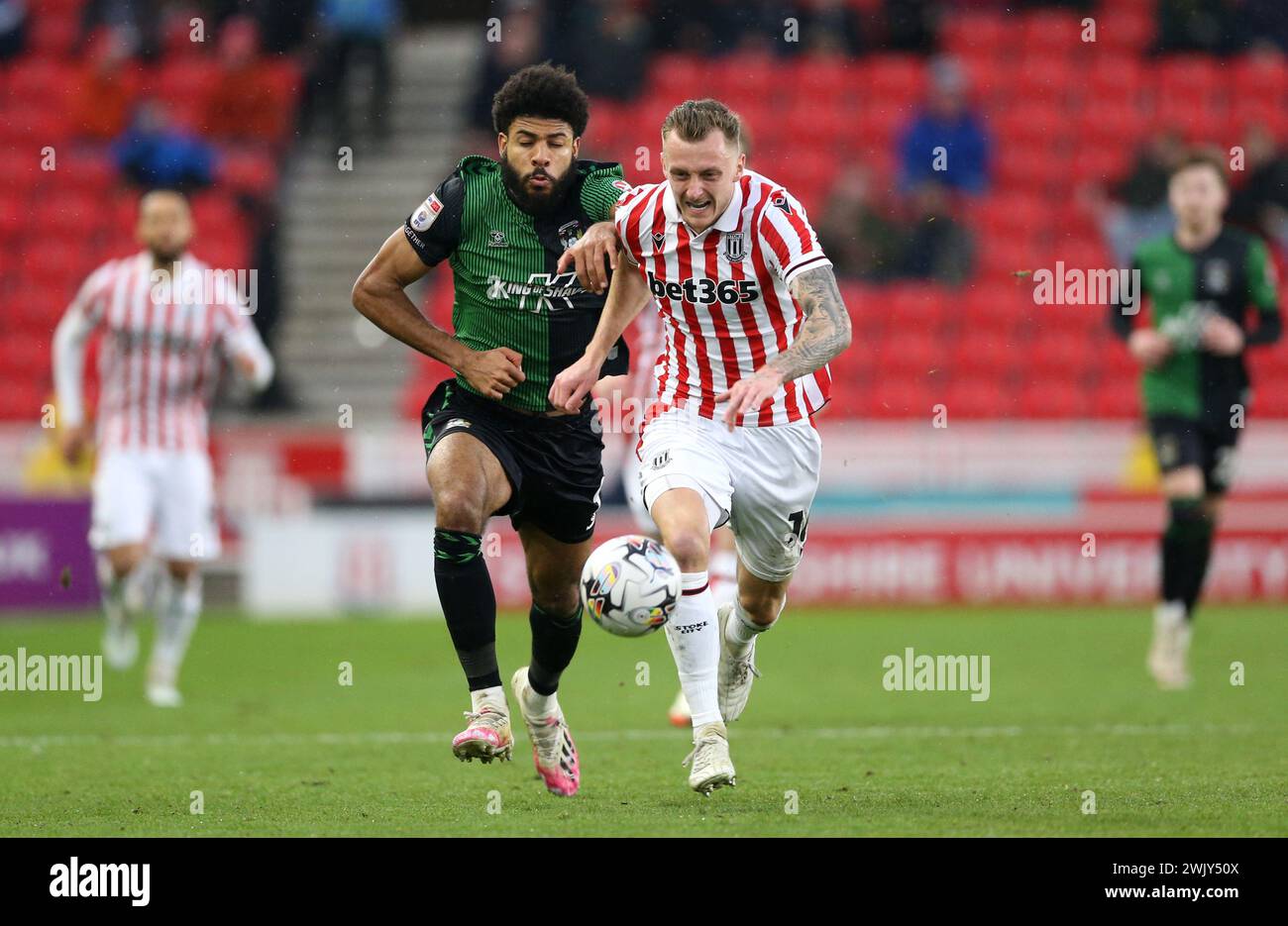 Coventry City's Ellis Simms (left) and Stoke City's Ben Wilmot battle ...