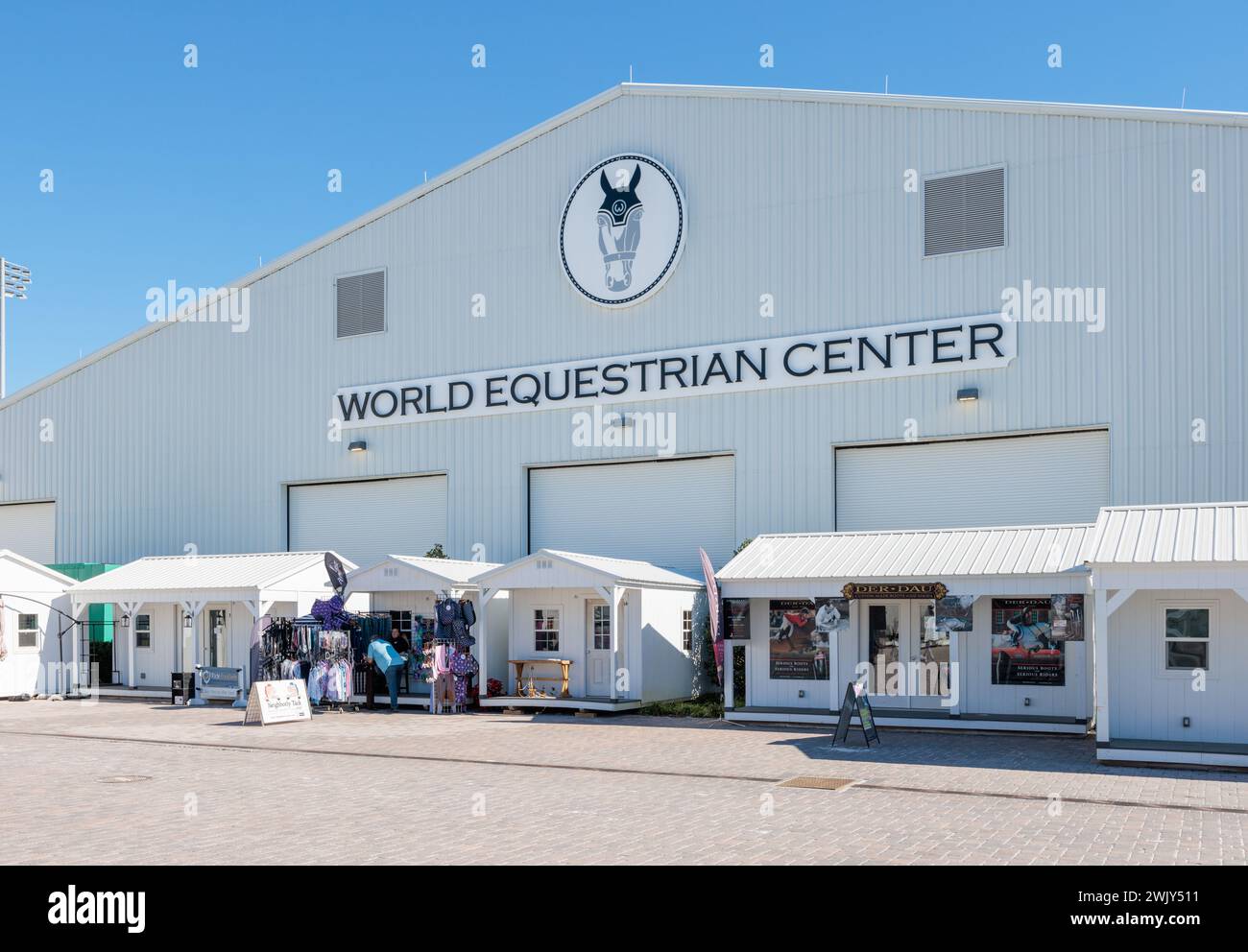 Small shops in portabal buildings in front of indoor arena building at ...