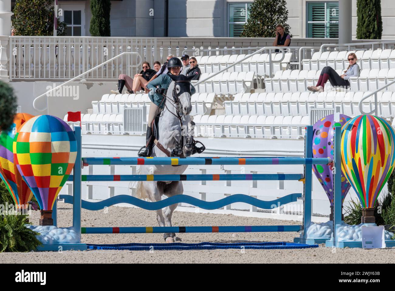 Woman competing in the Hunter Jumper competition in the Grand Outdoor ...