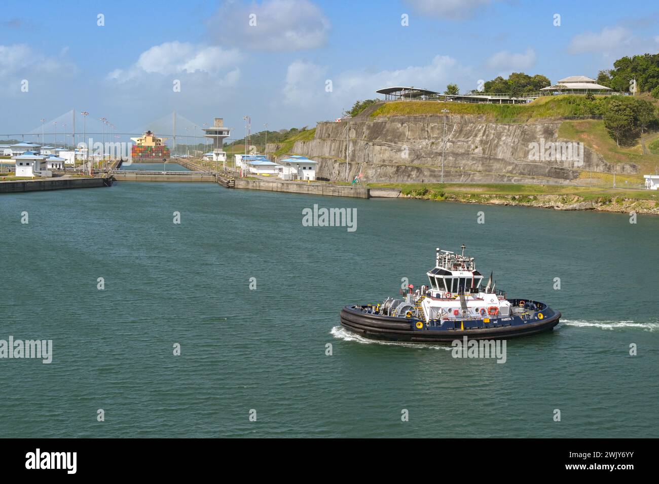 Colon, Panama - 23 January 2024: Tug boat in front of the Agua Clara ...