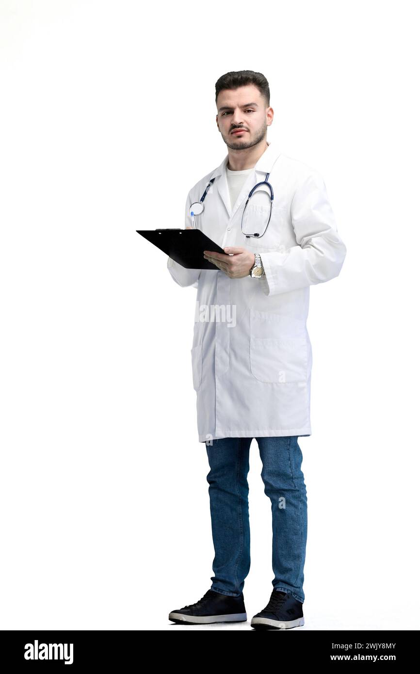 The doctor, in full height, on a white background, writes Stock Photo ...