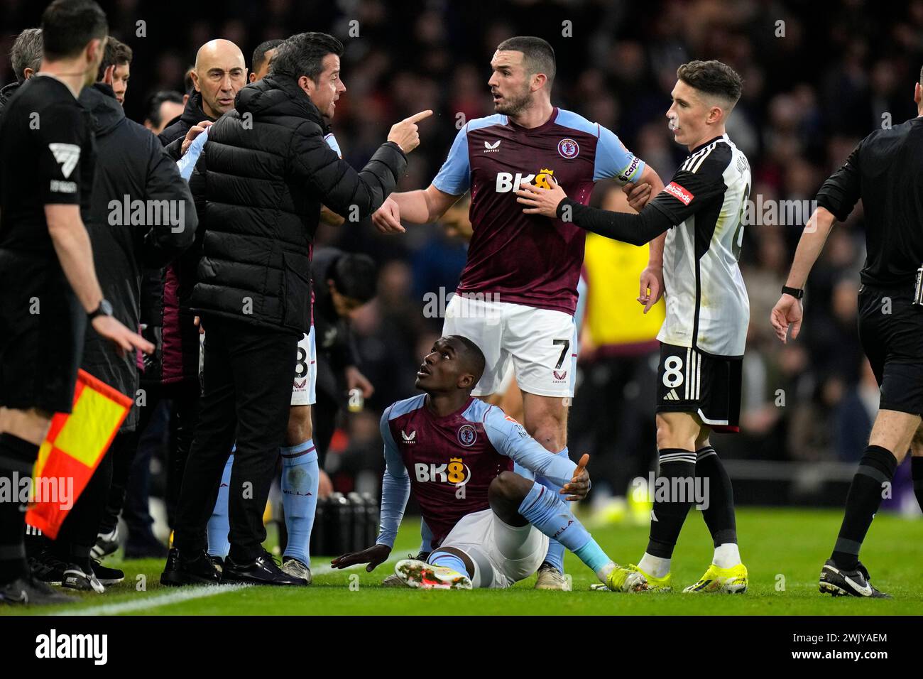 Fulham's head coach Marco Silva, left top reacts to Aston Villa's John ...