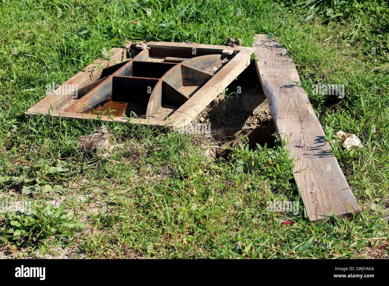 Large heavy custom made rectangle cast metal partially rusted manhole ...