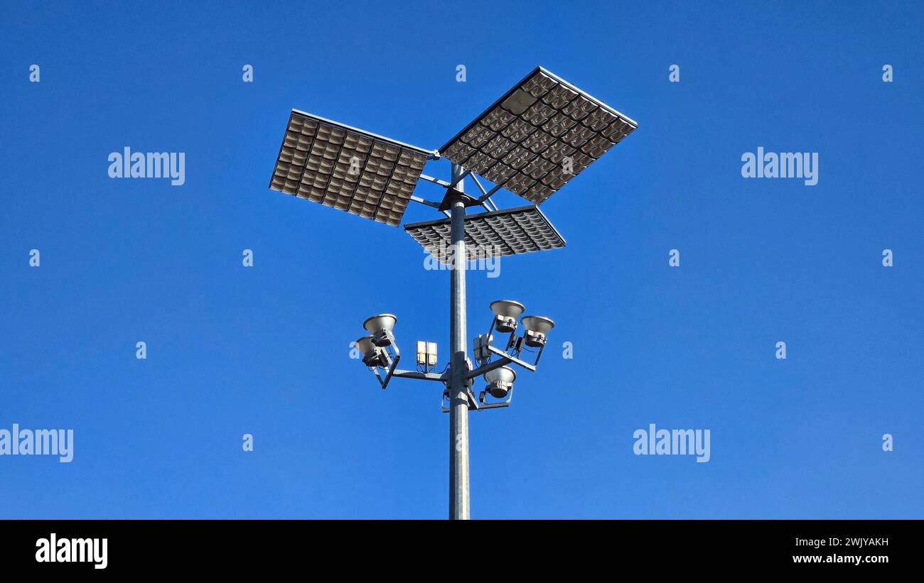 Massive strong light grey metal pole holding modern LED street light ...