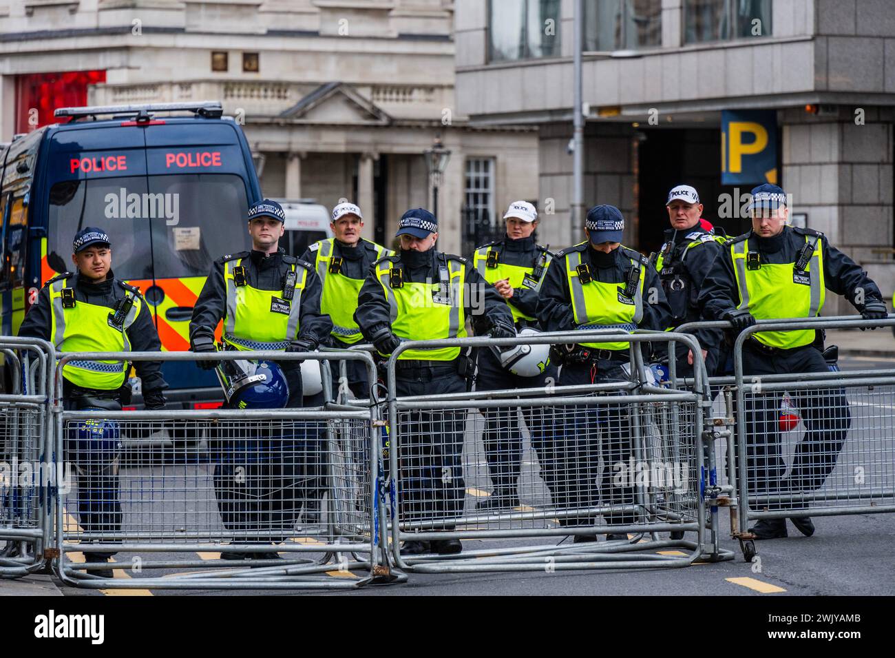 London, UK. 17th Feb, 2024. Riot police stand guard to block the way to ...