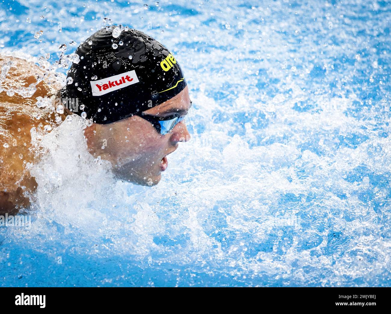 DOHA - Nyls Korstanje in action in the men's 100 butterfly final during ...