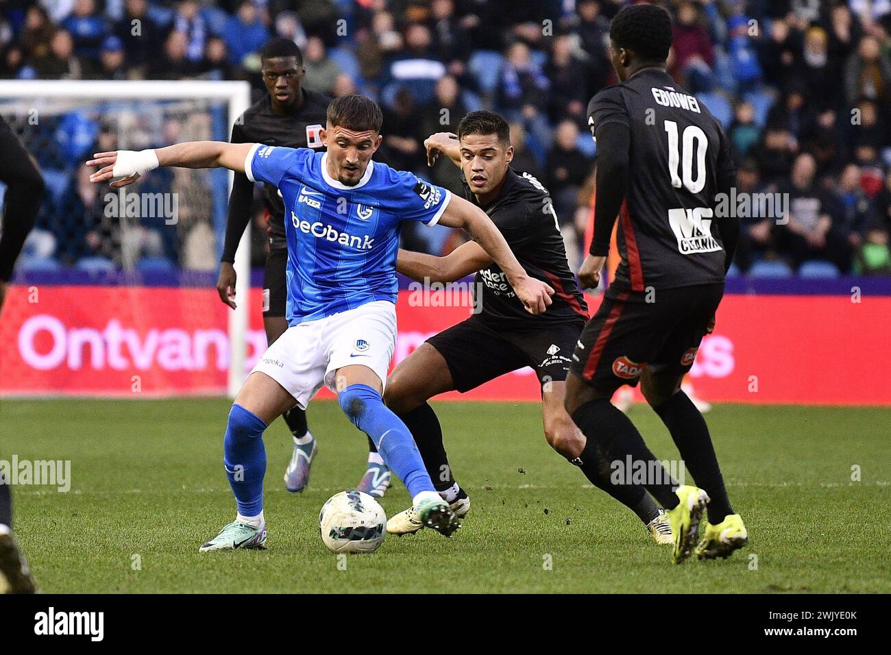 Genk, Belgium. 17th Feb, 2024. Genk's Andi Zeqiri and Rwdm's David ...
