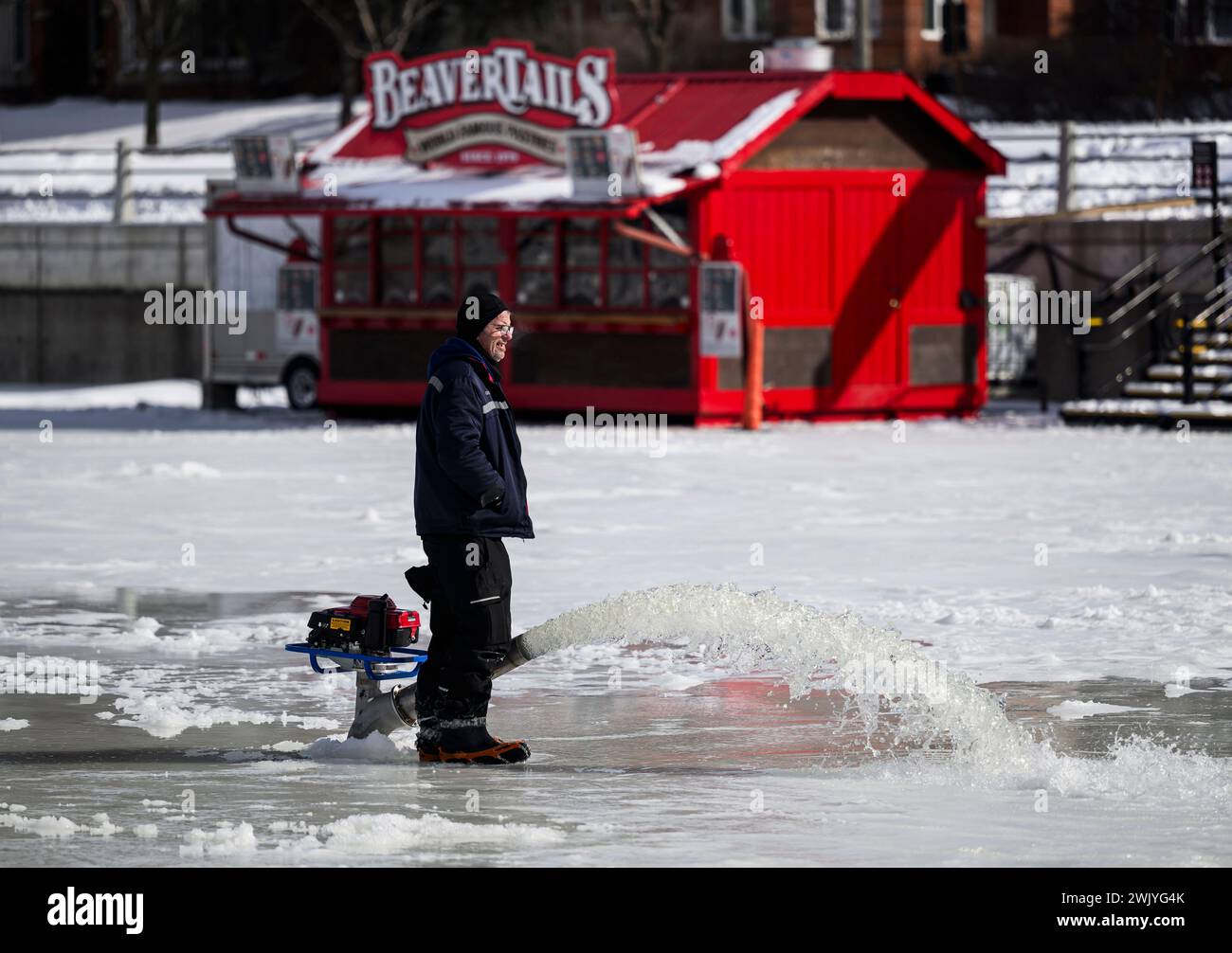 Ottawa, Canada. 17th Feb, 2024. A BeaverTails stand is seen past crews ...