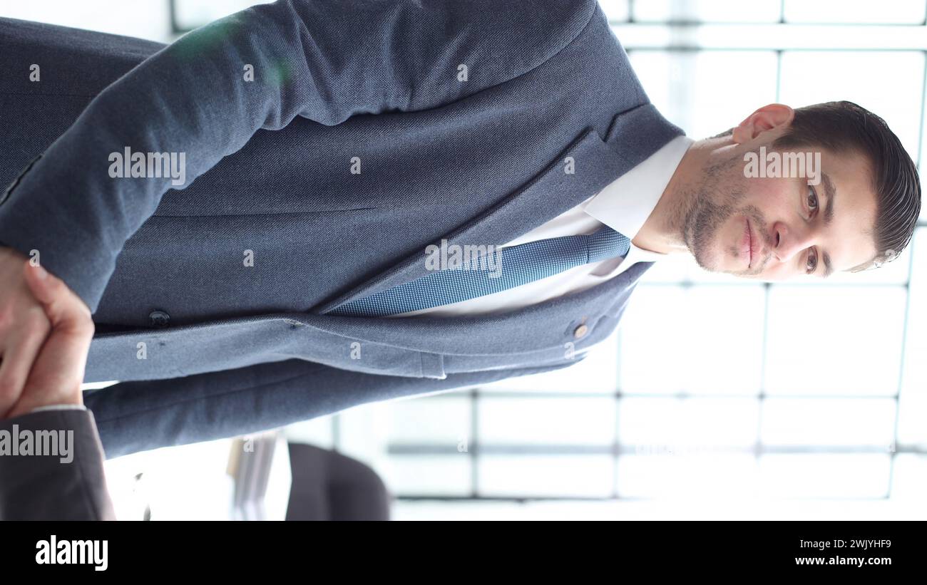A businessman man shakes hands with a colleague in close-up Stock Photo ...
