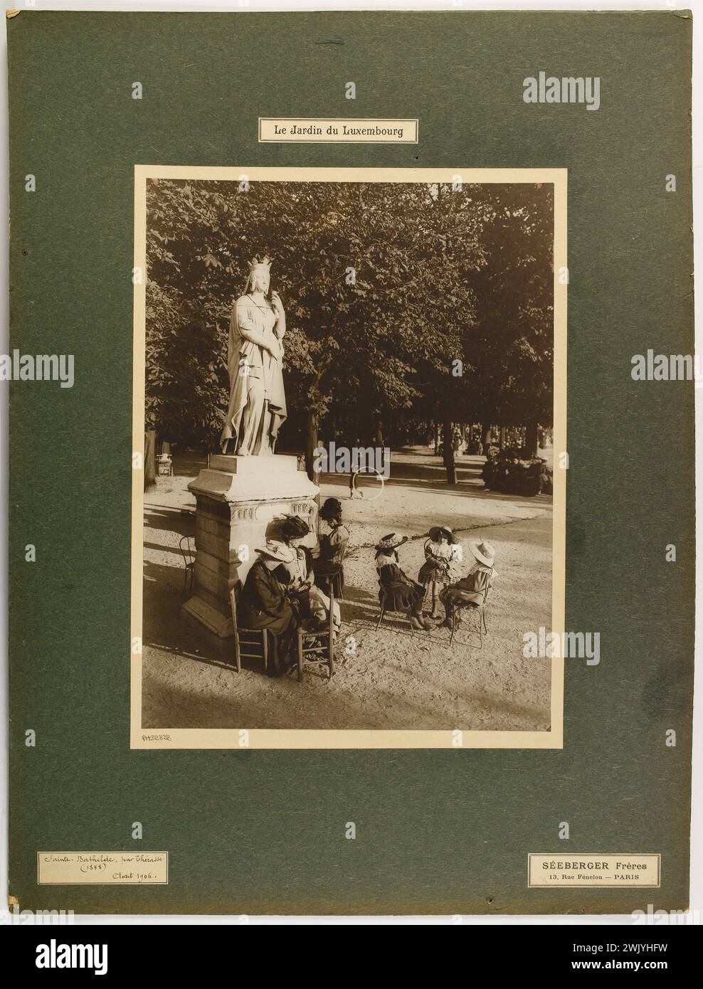 Women and children sitting next to the statue of Sainte-Bathilde, by ...