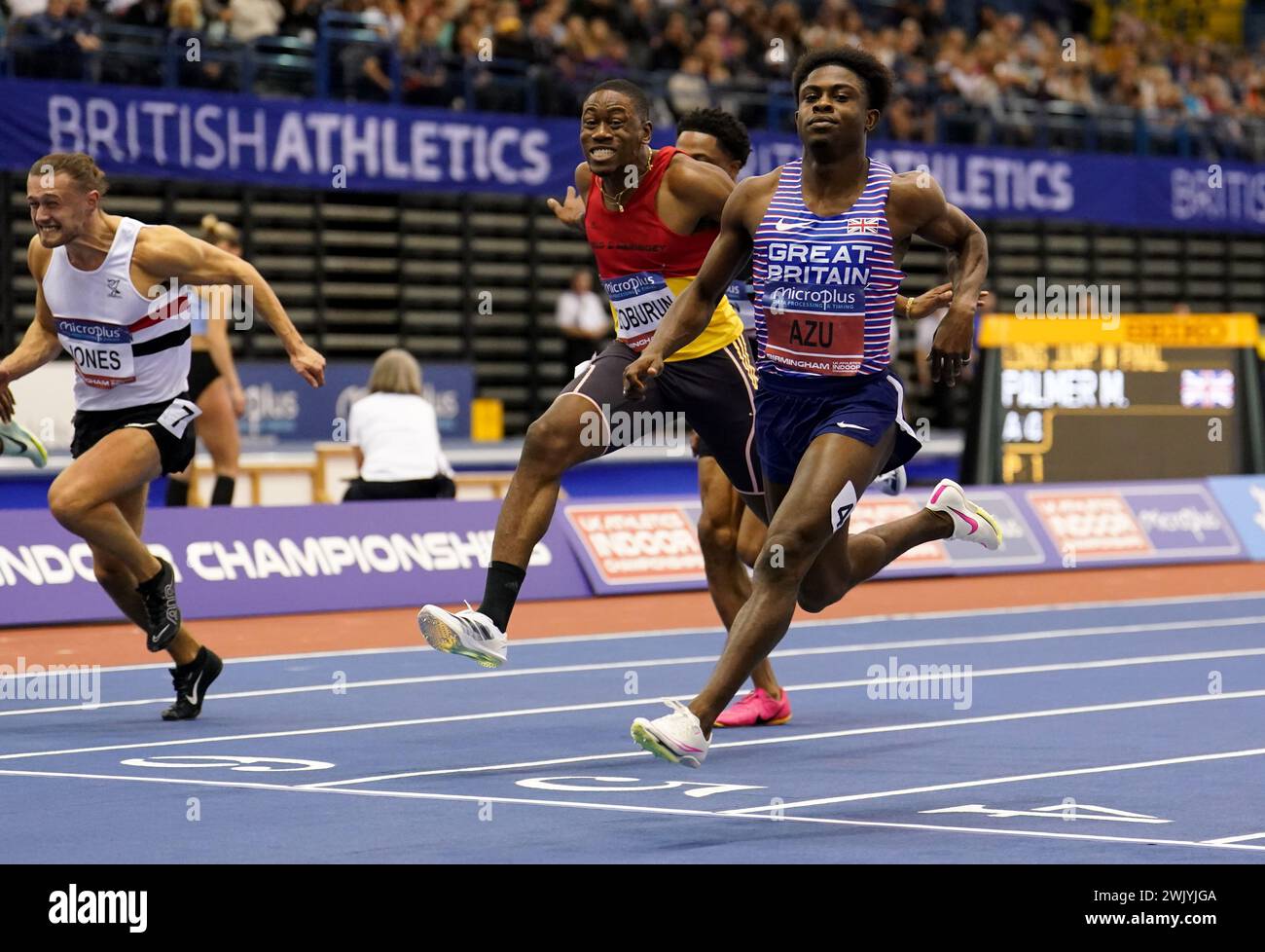 Jeremiah Azu (right) in lane 4 wins the 60 m - Men Final during day one of the 2024 Microplus UK ...