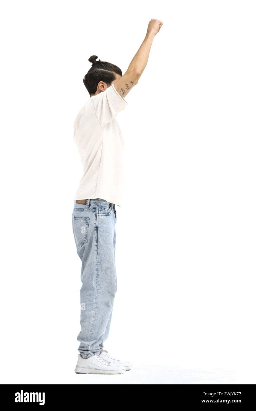 A man, full-length, on a white background, raised his hands up Stock ...