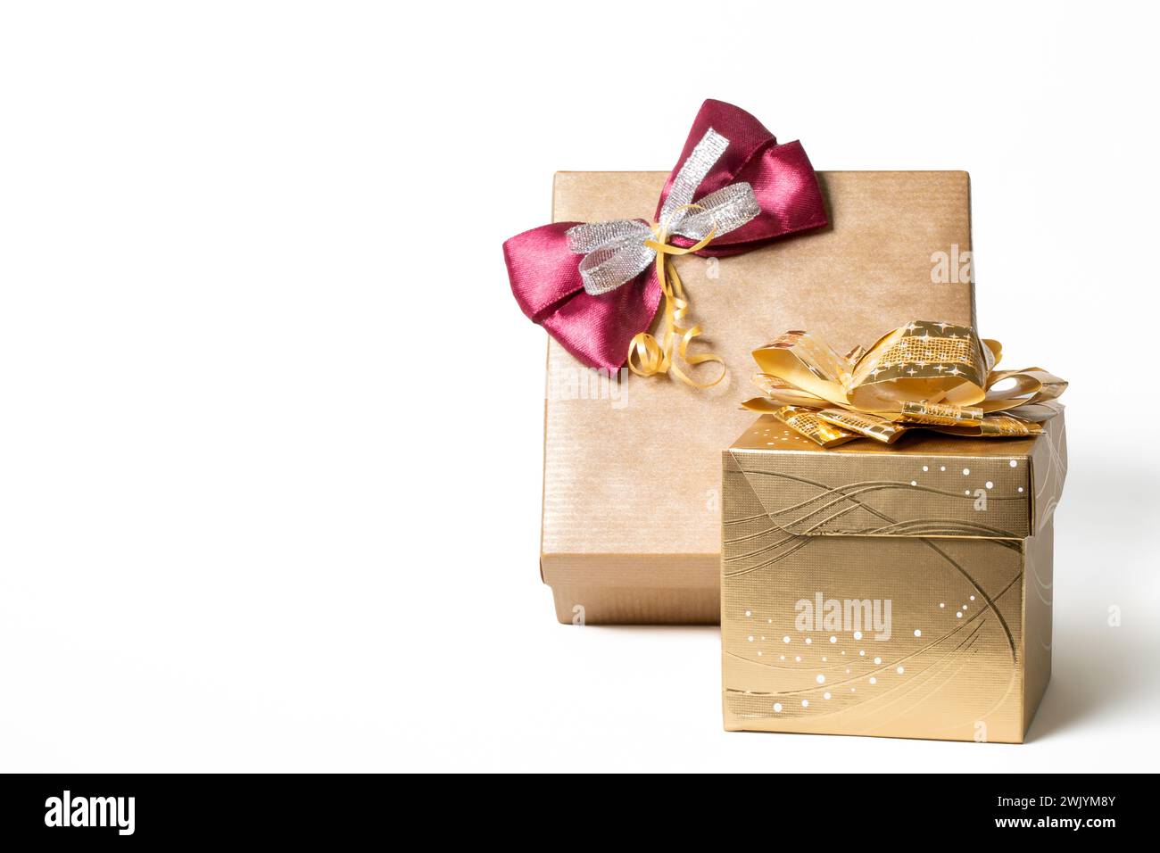 Two gift boxes with merlot and golden bows in golden colors isolated on ...