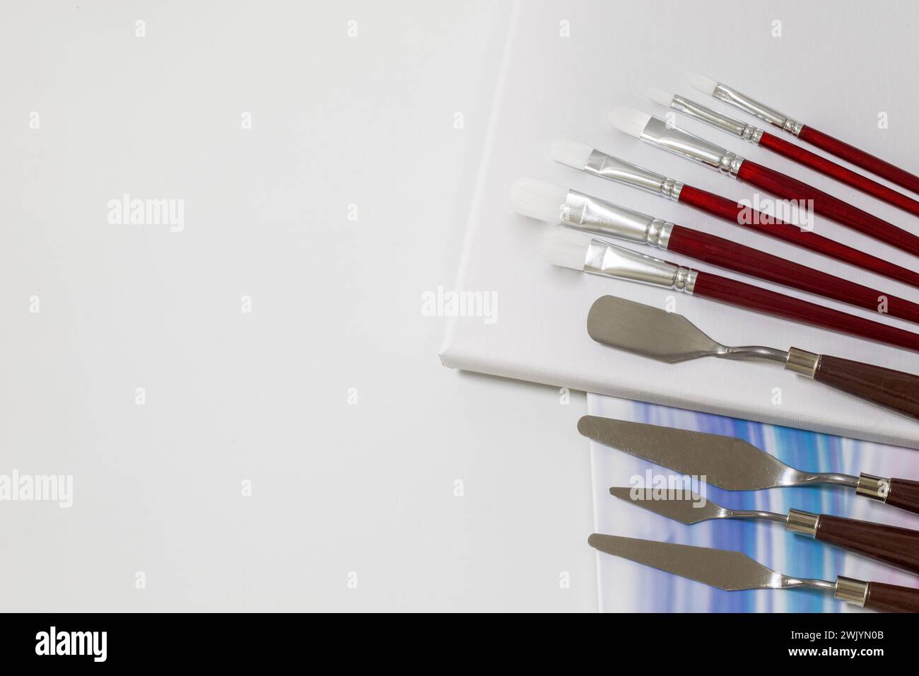 Art painting supplies - brushes, painting knives, canvas, painted paper ...